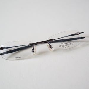 Oakley Small Eyeglasses Split Thread Polished Brown Rimless Frame 49 ...