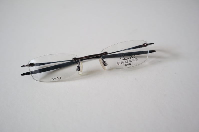 Oakley Small Eyeglasses Split Thread Polished Brown Rimless Frame 4919 ...