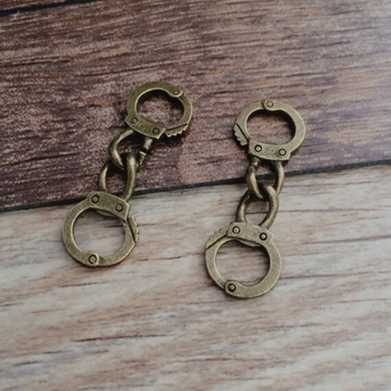 30pcs 33x11mm Handcuffs Charm Pendant Antique Bronze Charm - Etsy