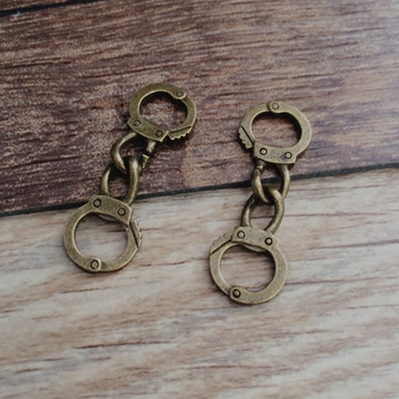 30pcs 33x11mm Handcuffs Charm Pendant Antique Bronze Charm - Etsy