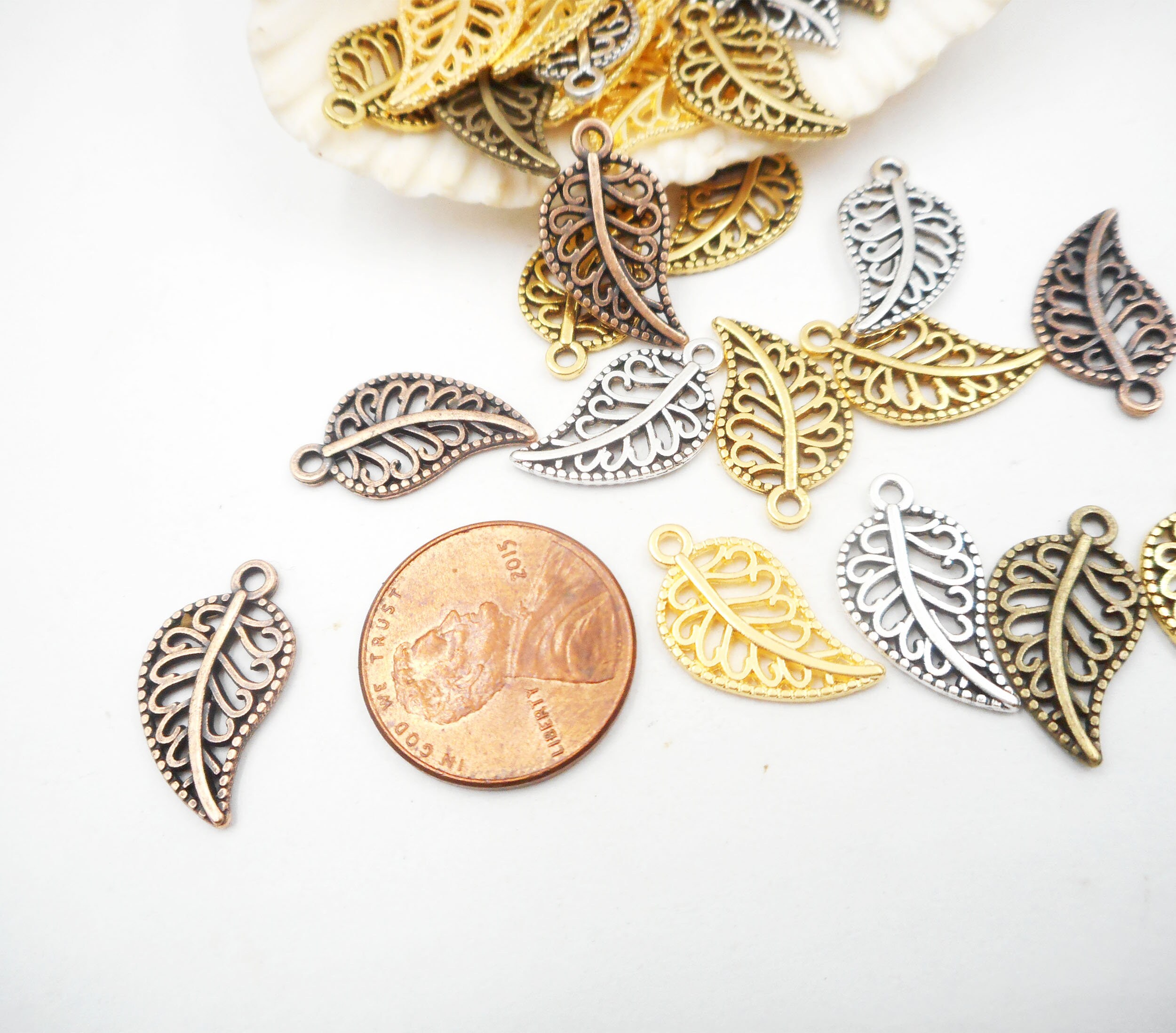 20 Assorted Filigree Leaf Charms Four of Each Color - Etsy