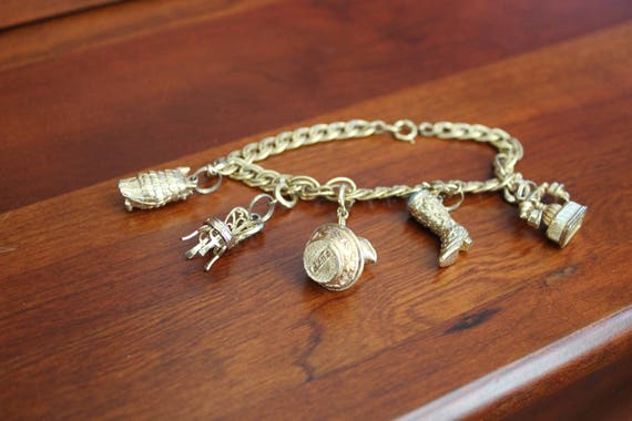 Avon gold plated charms bracelet right at home on gol… - Gem