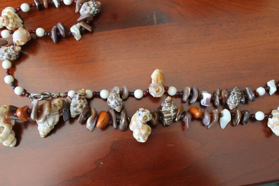 Sea Shells. Hawaiian style. Lei? Homes of tiny sea li… - Gem