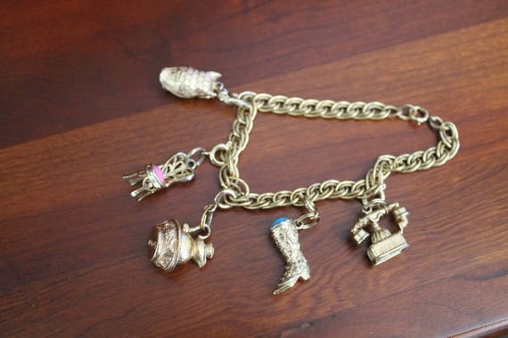 Avon gold plated charms bracelet right at home on gol… - Gem