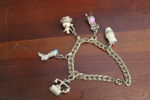 Avon gold plated charms bracelet right at home on gol… - Gem