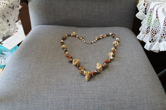 Sea Shells. Hawaiian style. Lei? Homes of tiny sea li… - Gem