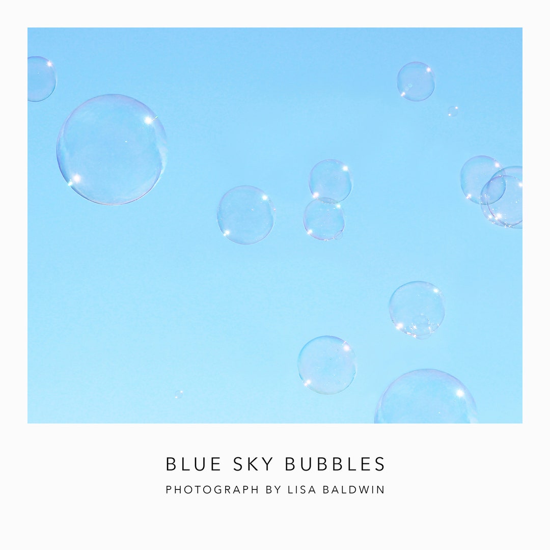 Iridescent Bubbles Floating on the Wind in a Blue Sky - Ethereal ...