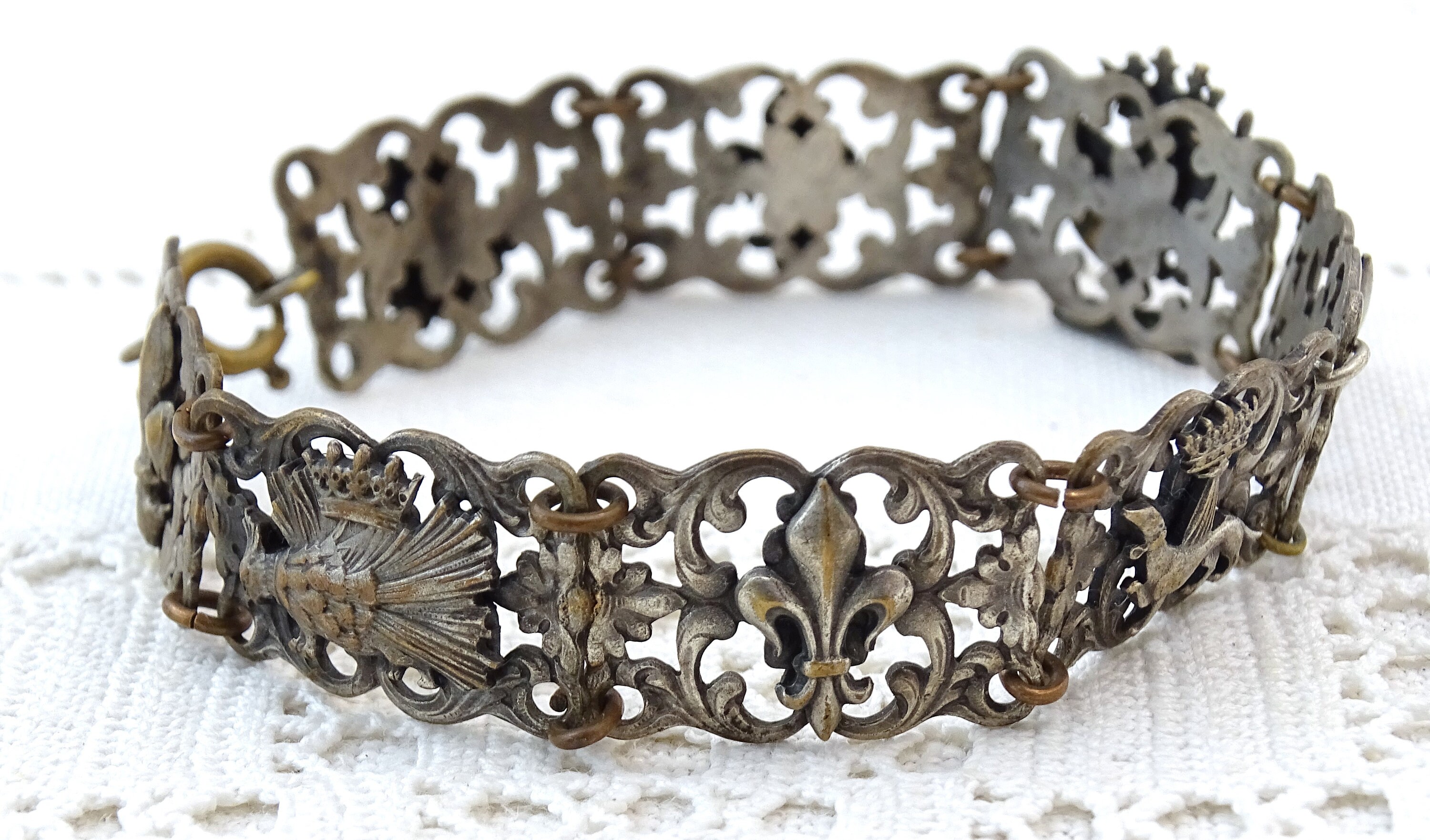 Antique Pierced Metal Bracelet with Fleur de Lys and Animal Symbols of ...
