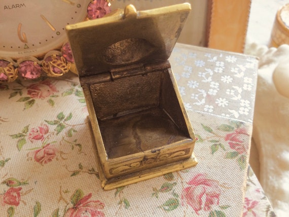 Antique brass postage stamp box with cherub face - Gem