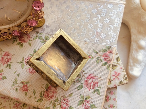 Antique brass postage stamp box with cherub face - Gem