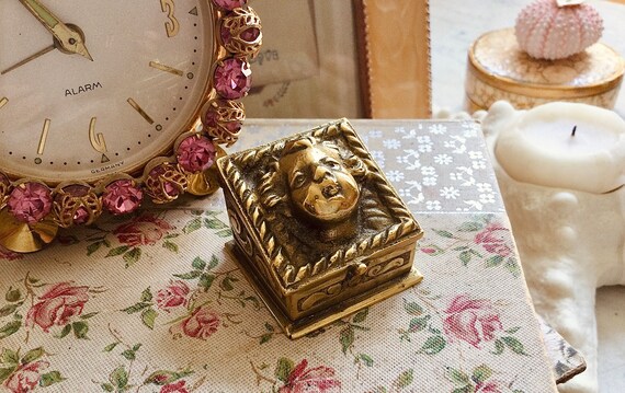 Antique brass postage stamp box with cherub face - Gem