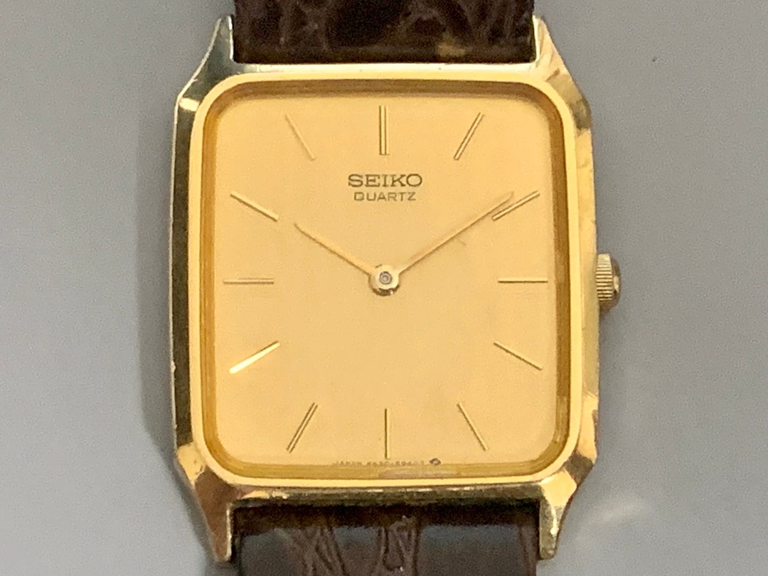 SEIKO Watch, Slim Quartz Battery Mens Watch, Golden Dial, Rectangular ...