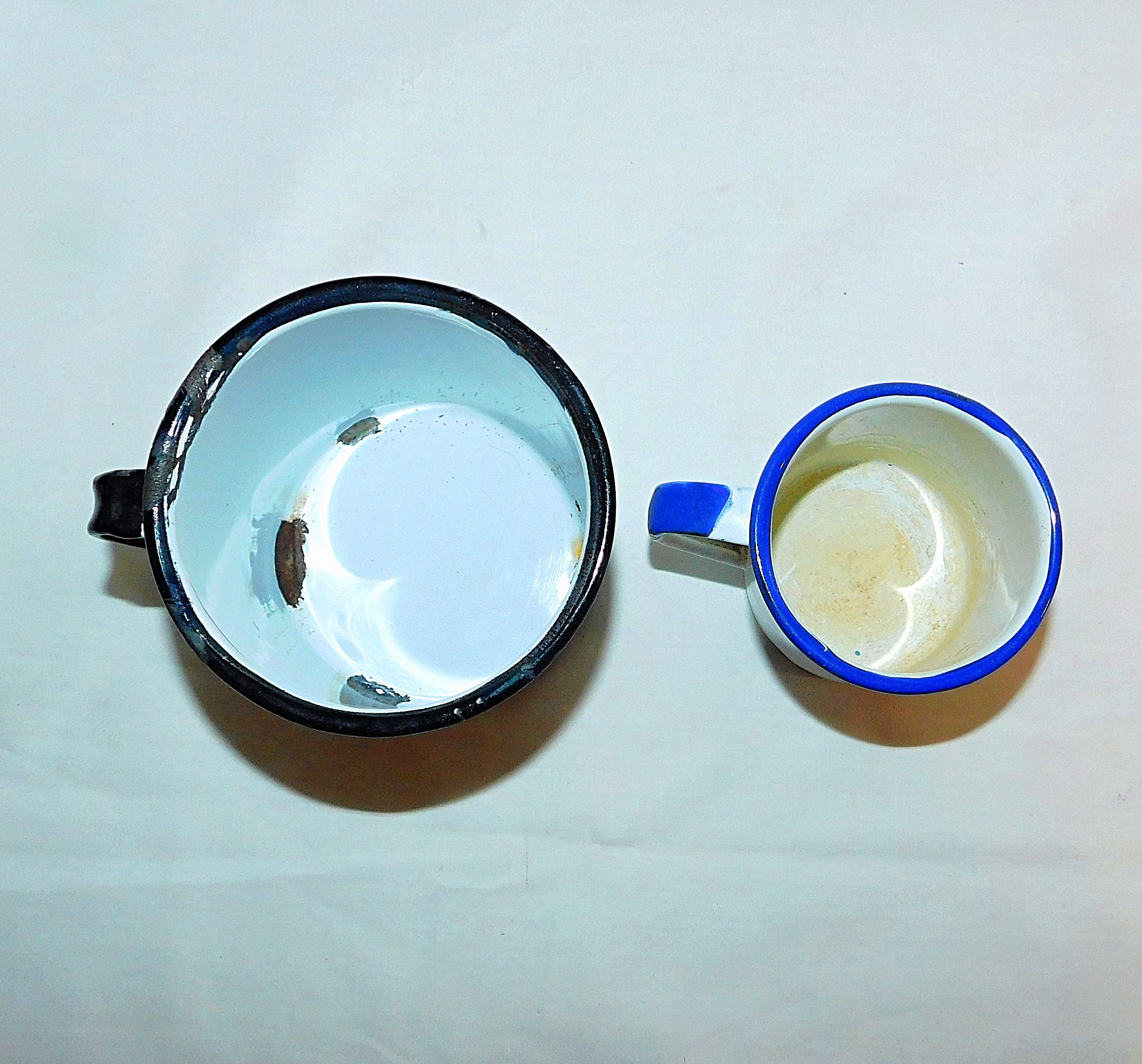 Two Vintage Enamelware Cups One White With Black Trim One White With ...