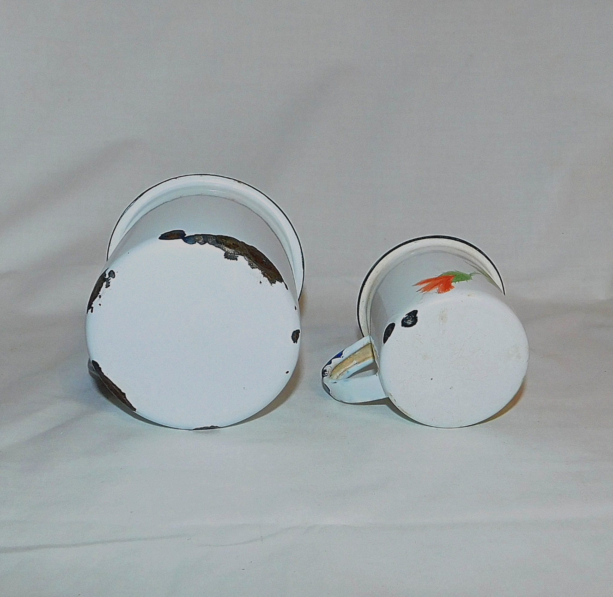 Two Vintage Enamelware Cups One White With Black Trim One White With ...
