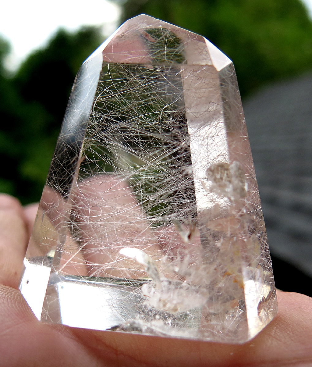 84 Gram silver rutile included quartz polished point. Good size, Brazil.