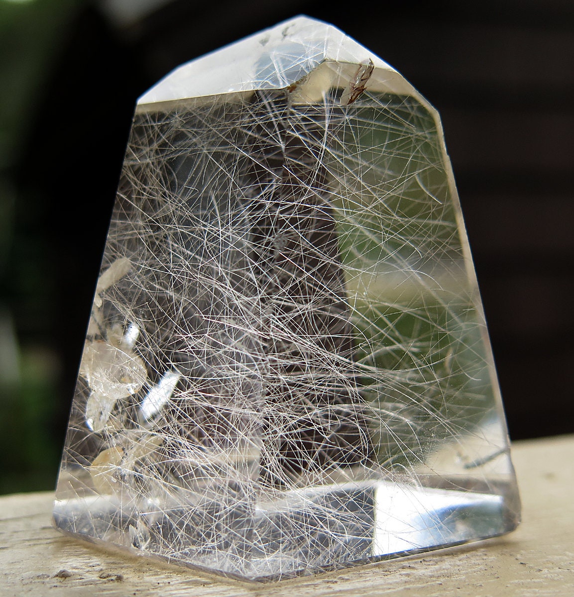 84 Gram silver rutile included quartz polished point. Good size, Brazil.