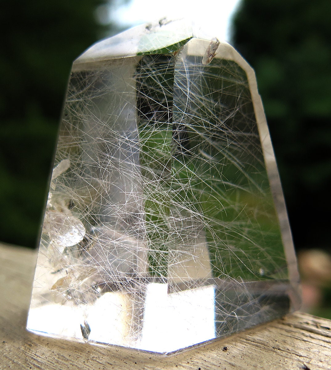 84 Gram silver rutile included quartz polished point. Good size, Brazil.