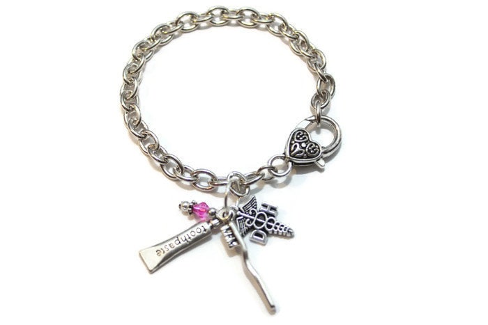 Hygiéniste dentaire DH caducée et dentifrice brosse à dents Charm ...