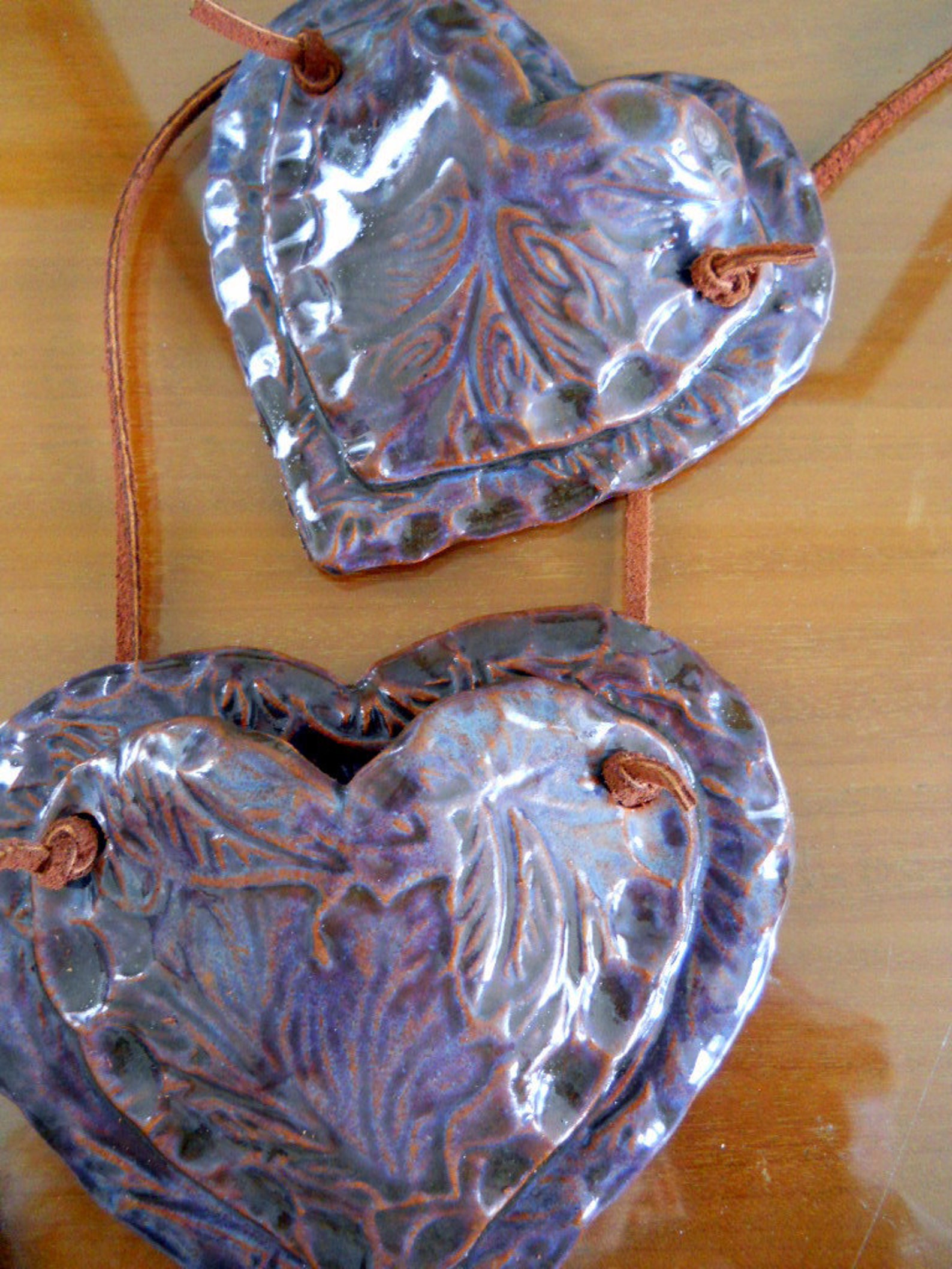 Three ceramic heart shaped wall pockets are embossed with | Etsy