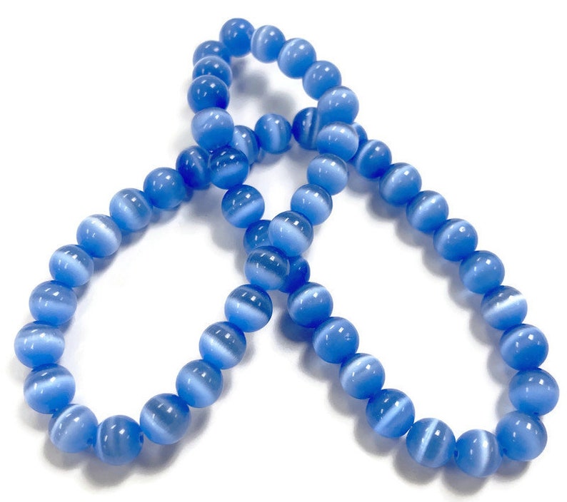 50 Cat's Eye Fiber Optic Glass Muted Light Sapphire 8mm. Smooth Round ...