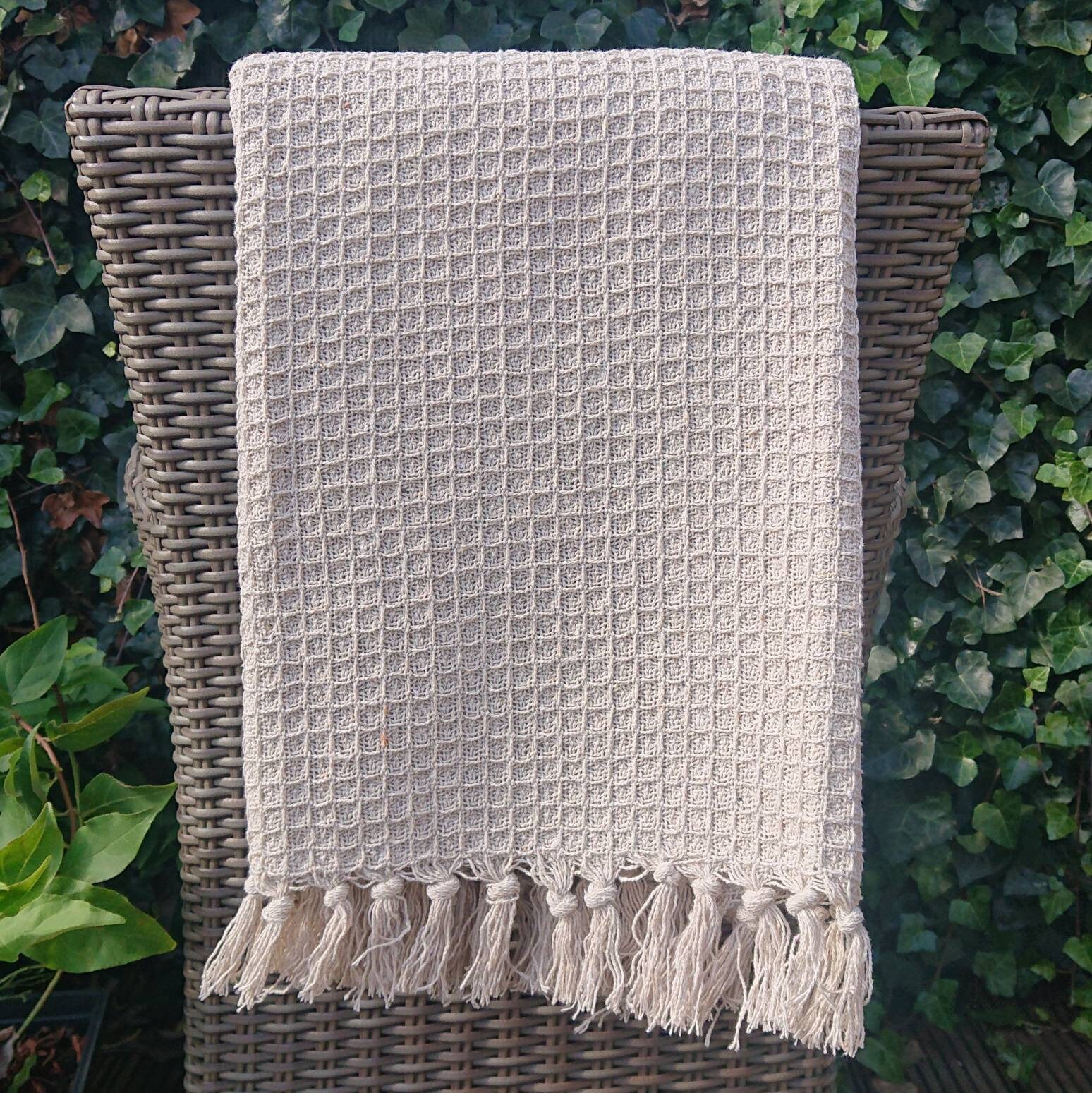 Recycled cotton waffle blanket with personalised embroidery.