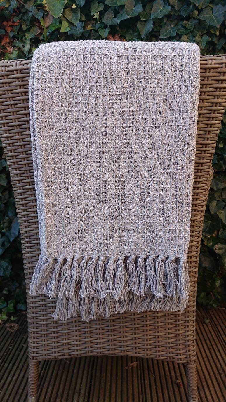 Recycled cotton waffle blanket with personalised embroidery.