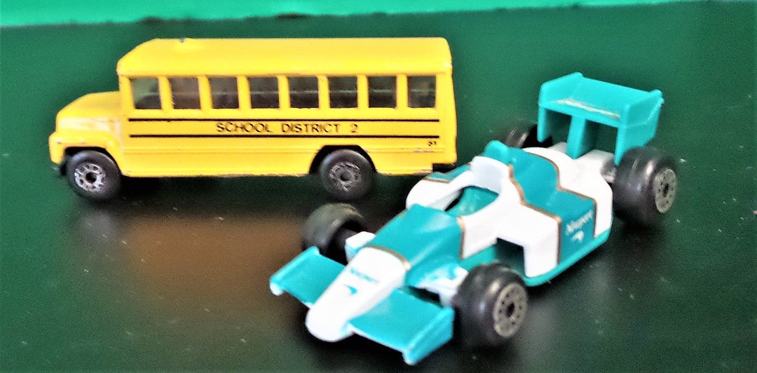 A Match Box 1985 School Bus #2 and a 1989 Racing Car - Etsy
