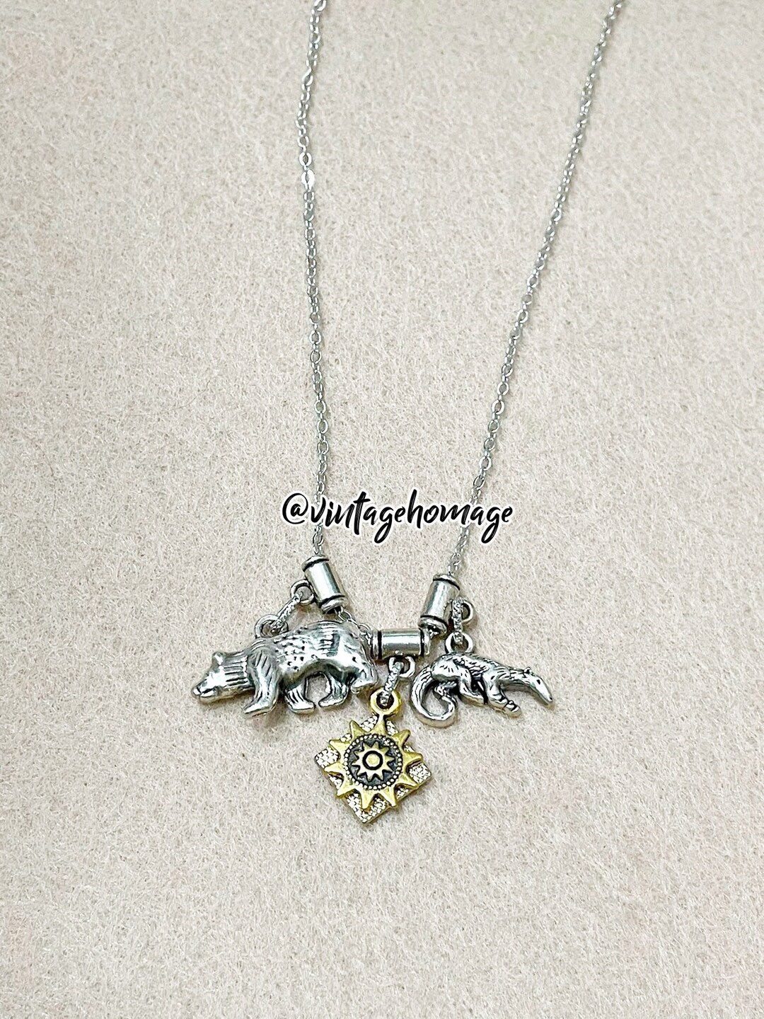 Lyra Necklace Armored Polar Bear, Gold Compass, Ermine Stoat Tools and ...