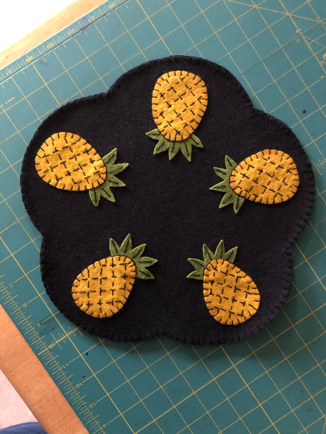 12 Inch Candle Mat With Black Background and Small Pineapples in the ...