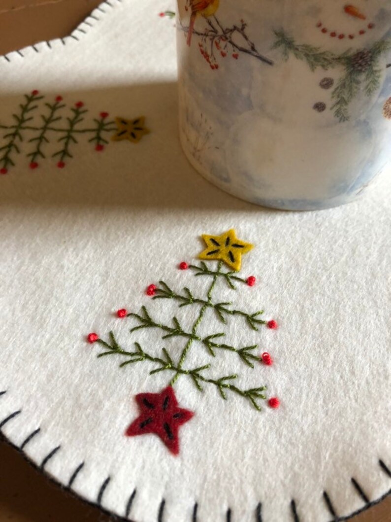 Feather Tree Candle Mat Shown on an off White Background Measuring 12 ...