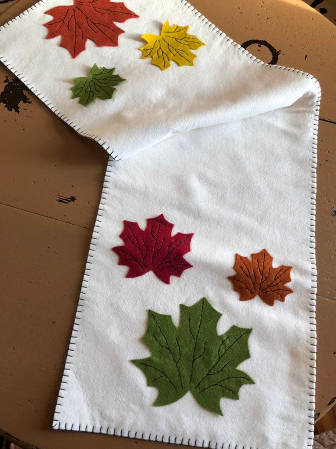 Primitive * Leaf Table Runner With an off White Background and Leaves ...