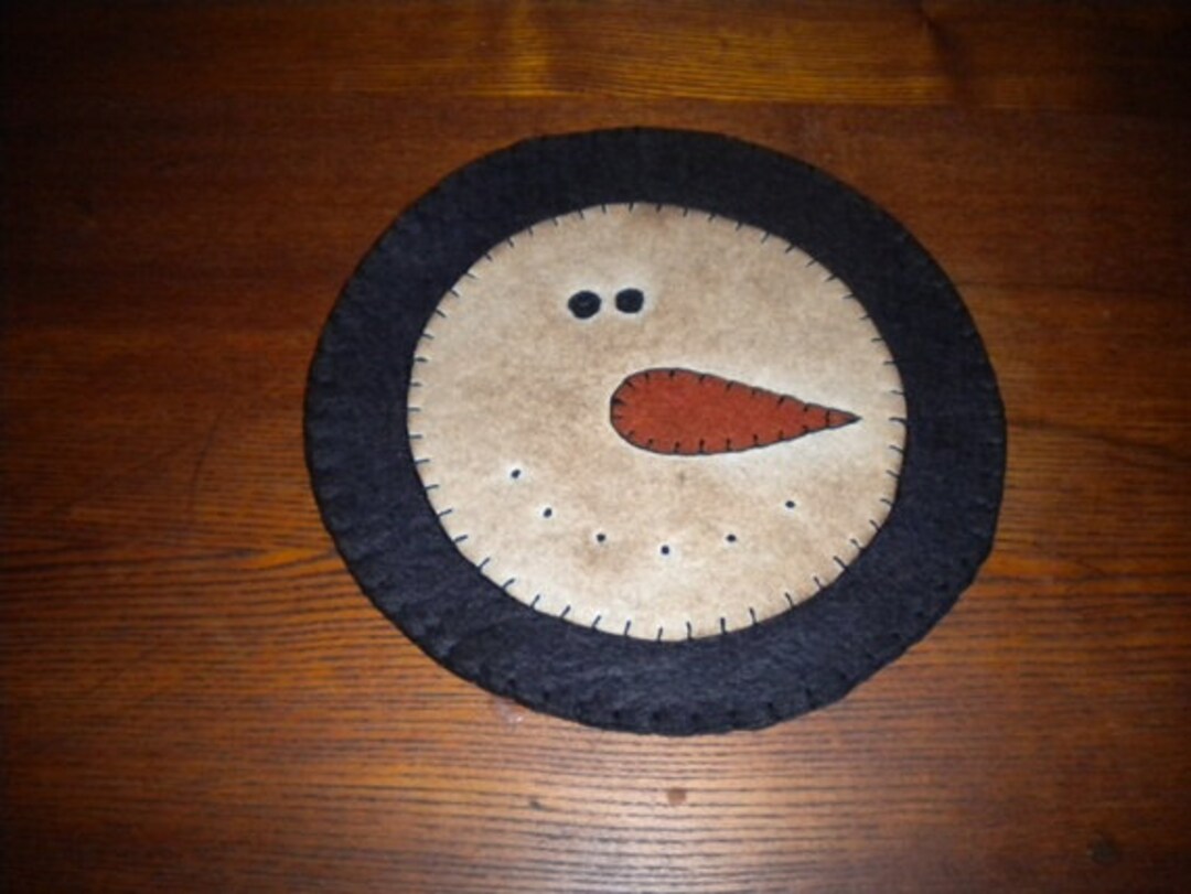 Candle Mat With a Snowman Face Stitched on a Black Background Measuring ...