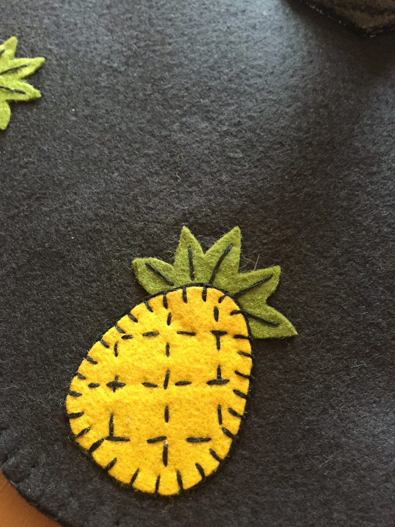 12 Inch Candle Mat With Black Background and Small Pineapples in the ...