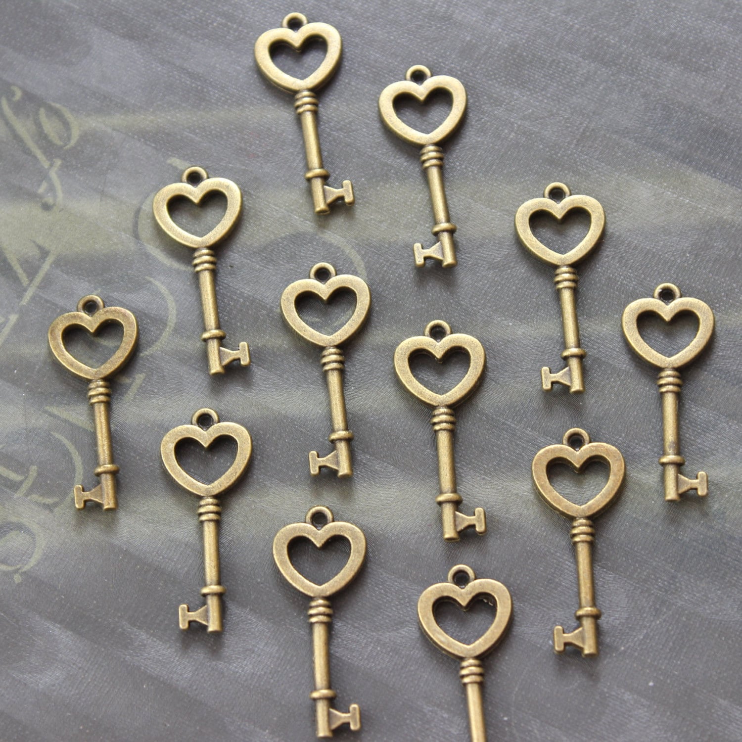 50 Pcs Small Antique Brass Double Sided Skeleton Key Charm - Etsy