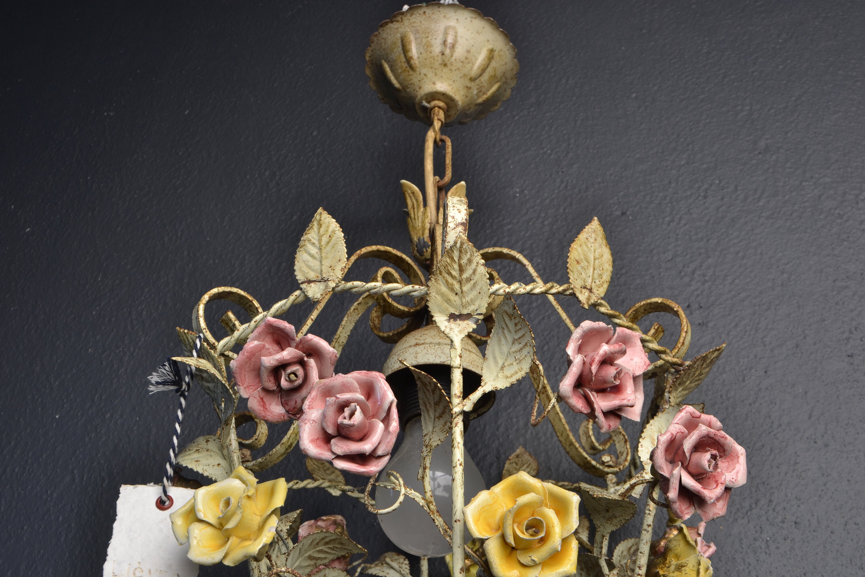 Hanging chandelier with pink and yellow porcelain roses