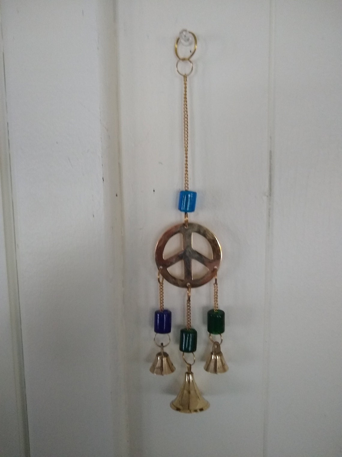 Shiny peace sign wind chime in brass with beads and bells | Etsy