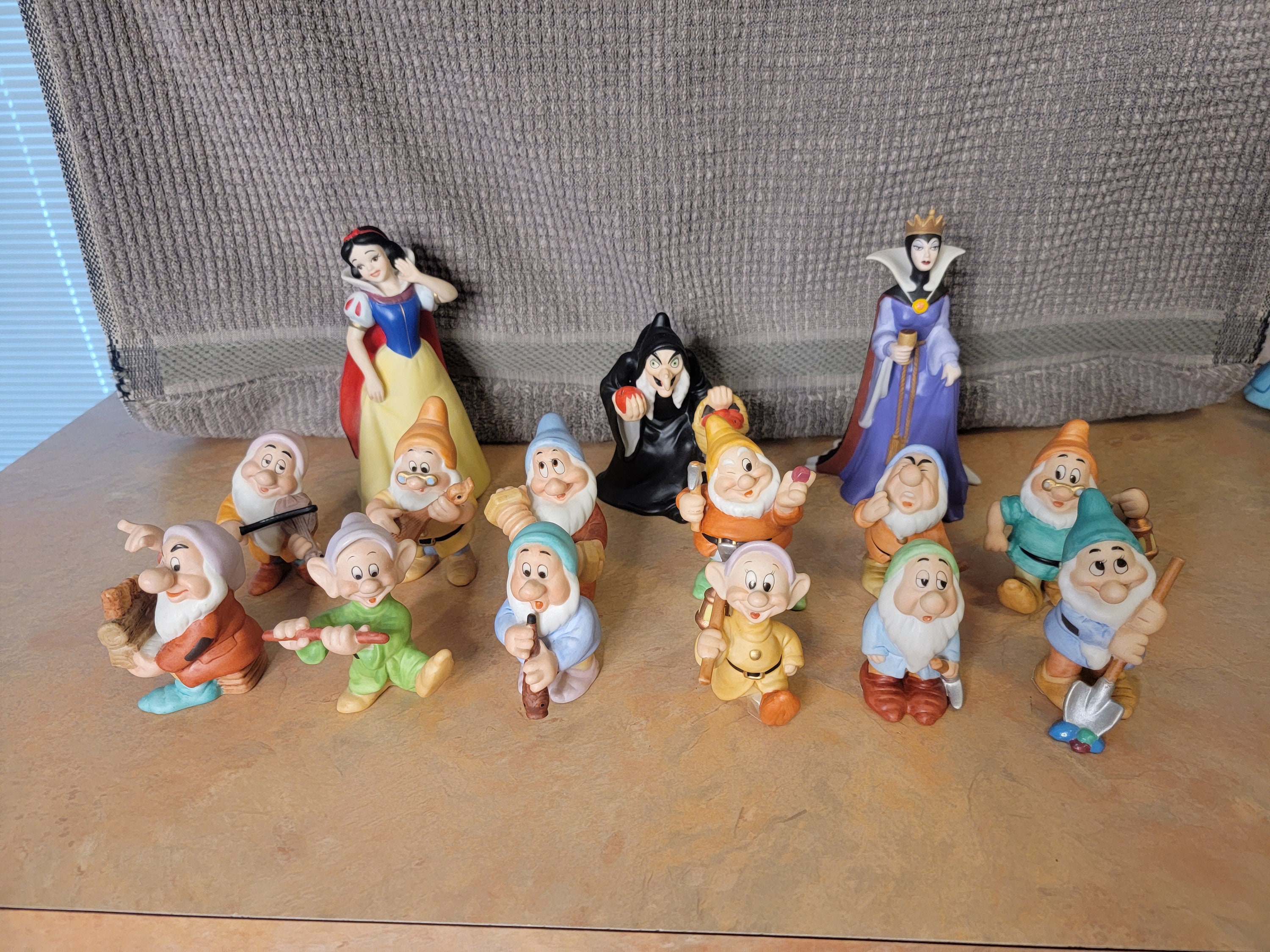 A set of ceramic ready to paint snow white and the seven dwarfs ...