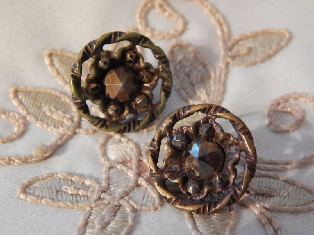 Pierced Brass Frame With Facet Cut Steels That Have a Reddish Tint ...