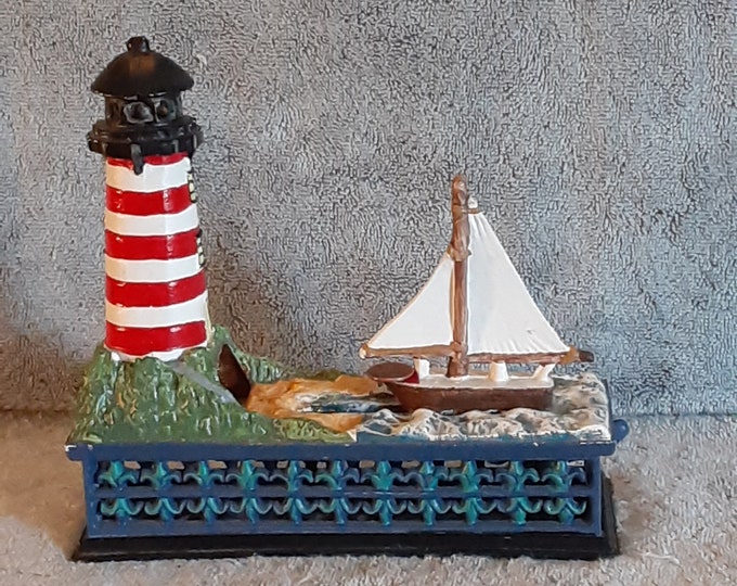 Mechanical Bank Cast Iron - Lighthouse and Sailboat Theme - Lighthouse ...