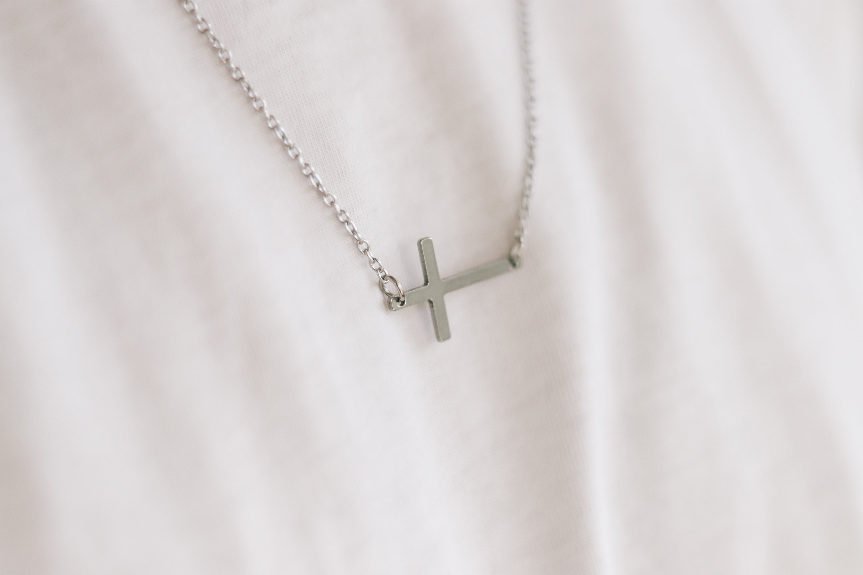 Sideways cross necklace etsy store