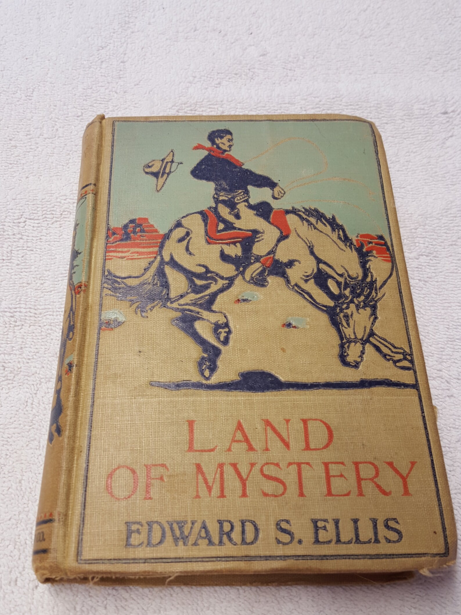 Book land of Mystery by Edward S. Ellis With a Picture of a Cowboy on a ...