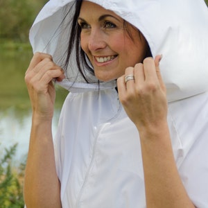 A Quirky Waterproof Bridal Cloak to Protect a Bride and Her Wedding ...
