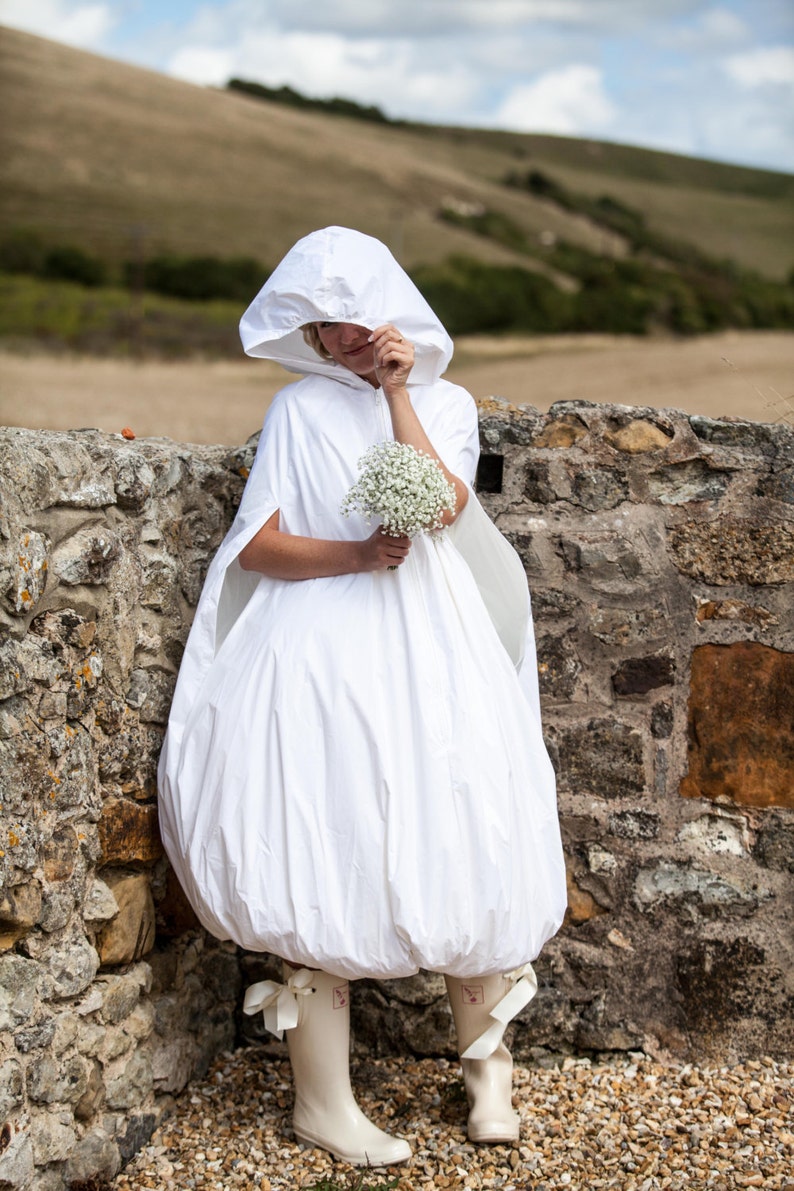 A Quirky Waterproof Bridal Cloak to Protect a Bride and Her Wedding ...