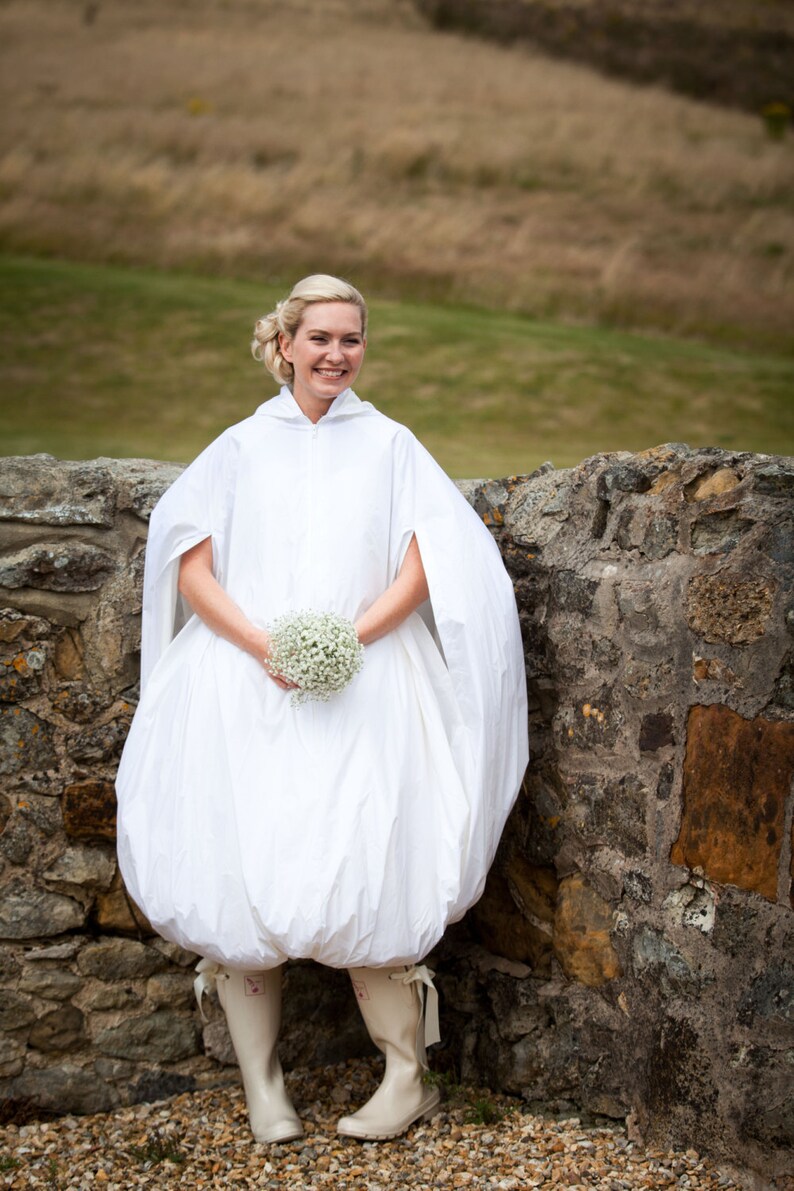 A Quirky Waterproof Bridal Cloak to Protect a Bride and Her Wedding ...