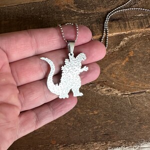 Godzilla 1954 Necklace Hammered Texture Pendant Movie Monsters Fan ...