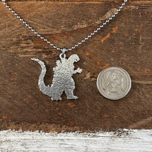 Godzilla 1954 Necklace Hammered Texture Pendant Movie Monsters Fan ...