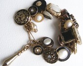 Items similar to Upcycled vintage buttons charm bracelet on Etsy