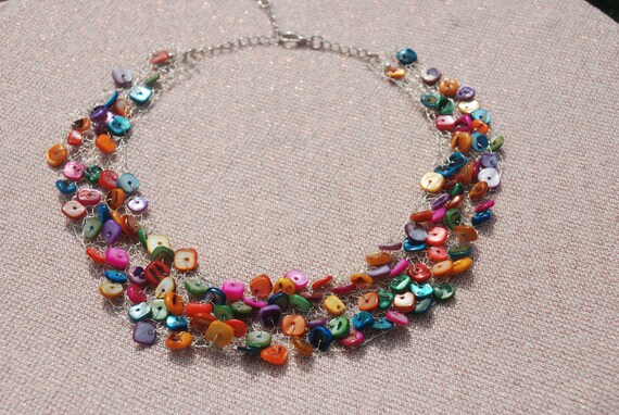 Items similar to multi color knitted wire necklace with shell beads on Etsy