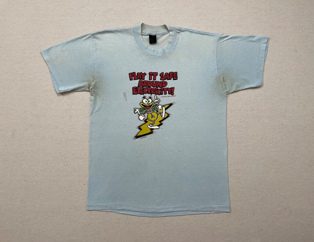 1991, "play It Safe Around Electricity!" Louie the Lightning Bug Tee in ...