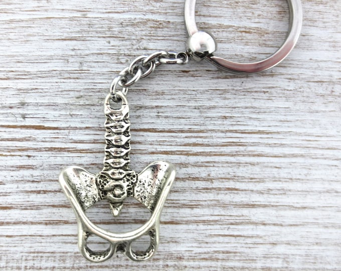 Spine Key Chain - Etsy